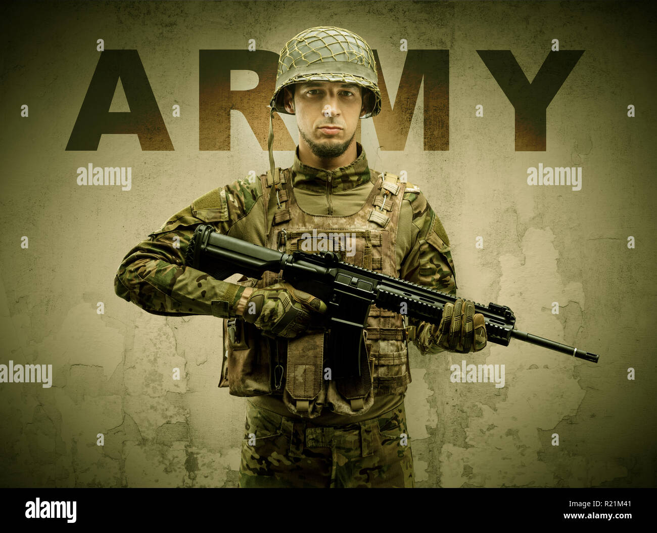 Uniformed armed soldier with damaged wall background Stock Photo - Alamy