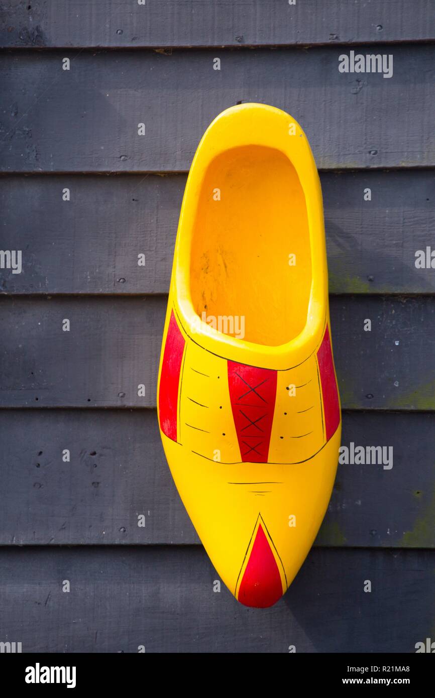 souvenir traditional dutch wooden shoes klomp on a wooden wall Stock ...