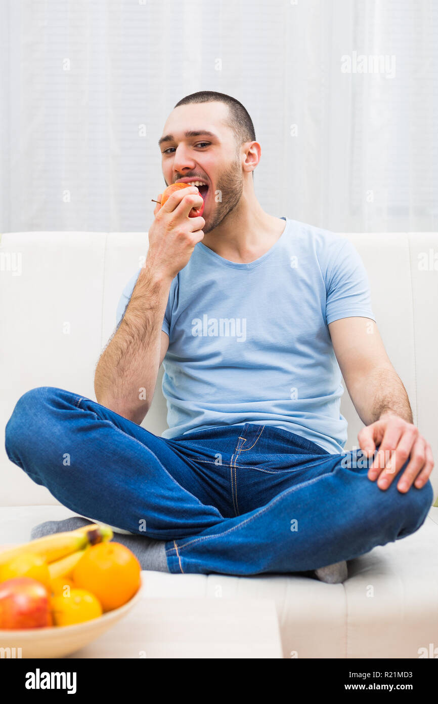 Man eating snack energy hi-res stock photography and images - Alamy