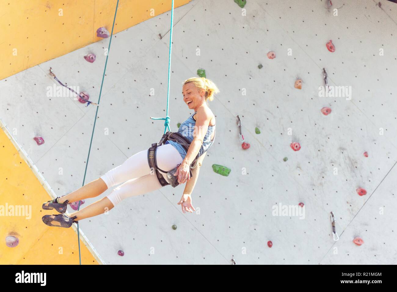 sport. bouldering - girl climbing up the wall Stock Photo - Alamy