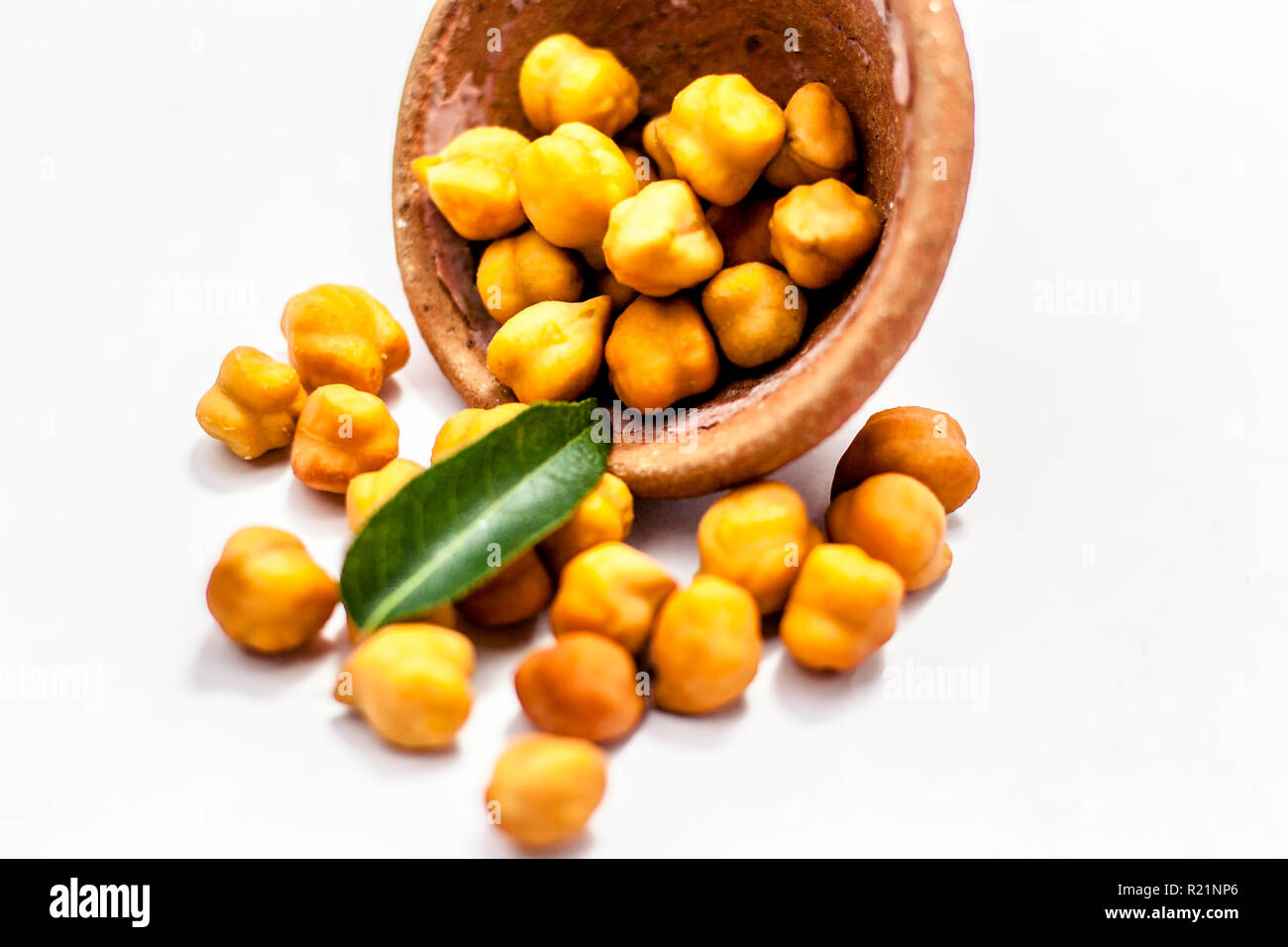 Raw bright dark brown colored Desi chana or original chickpea in a ...