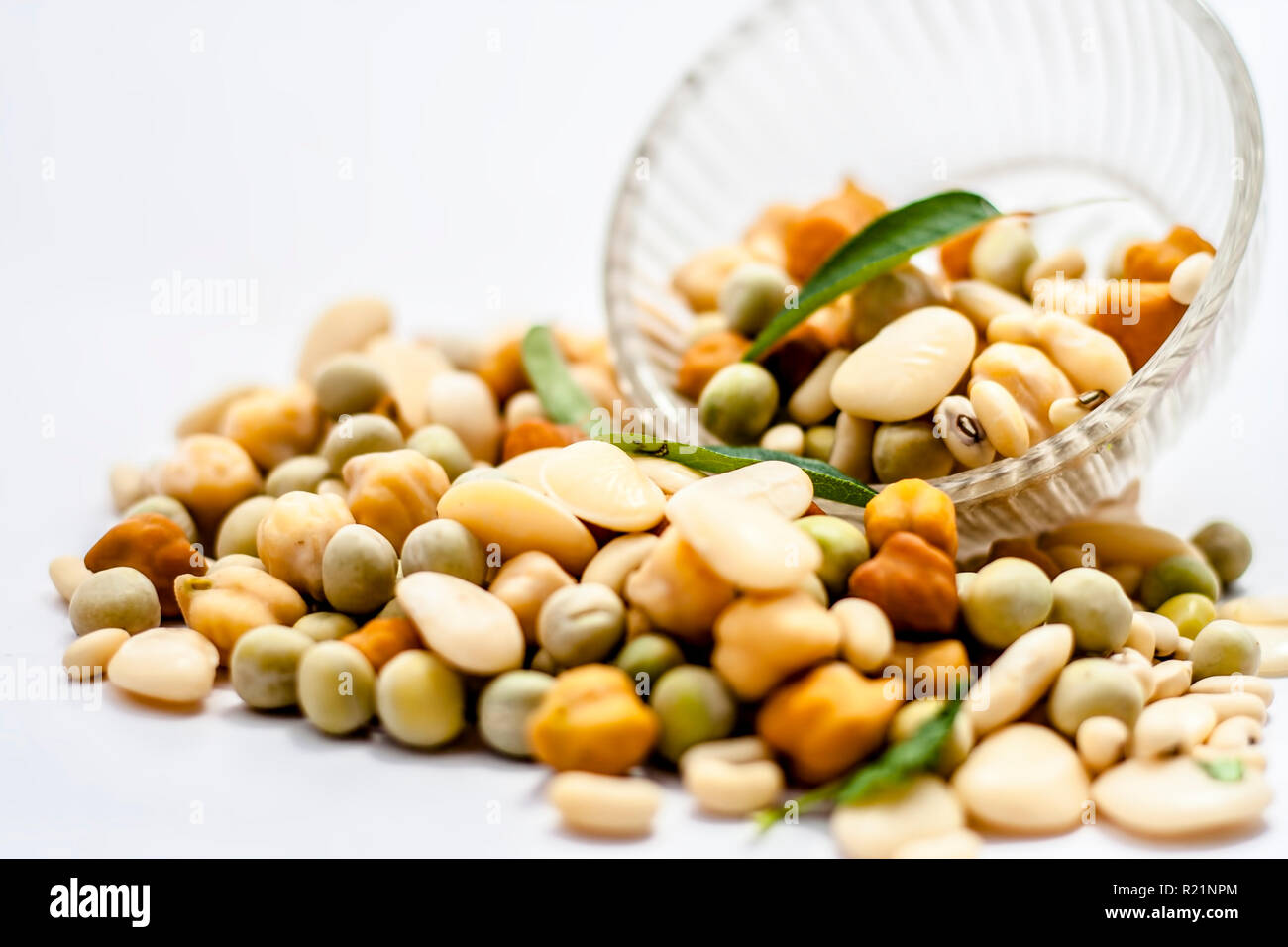 Raw dried organic fresh mixed pulses or mixed grains in a glass bowl ...