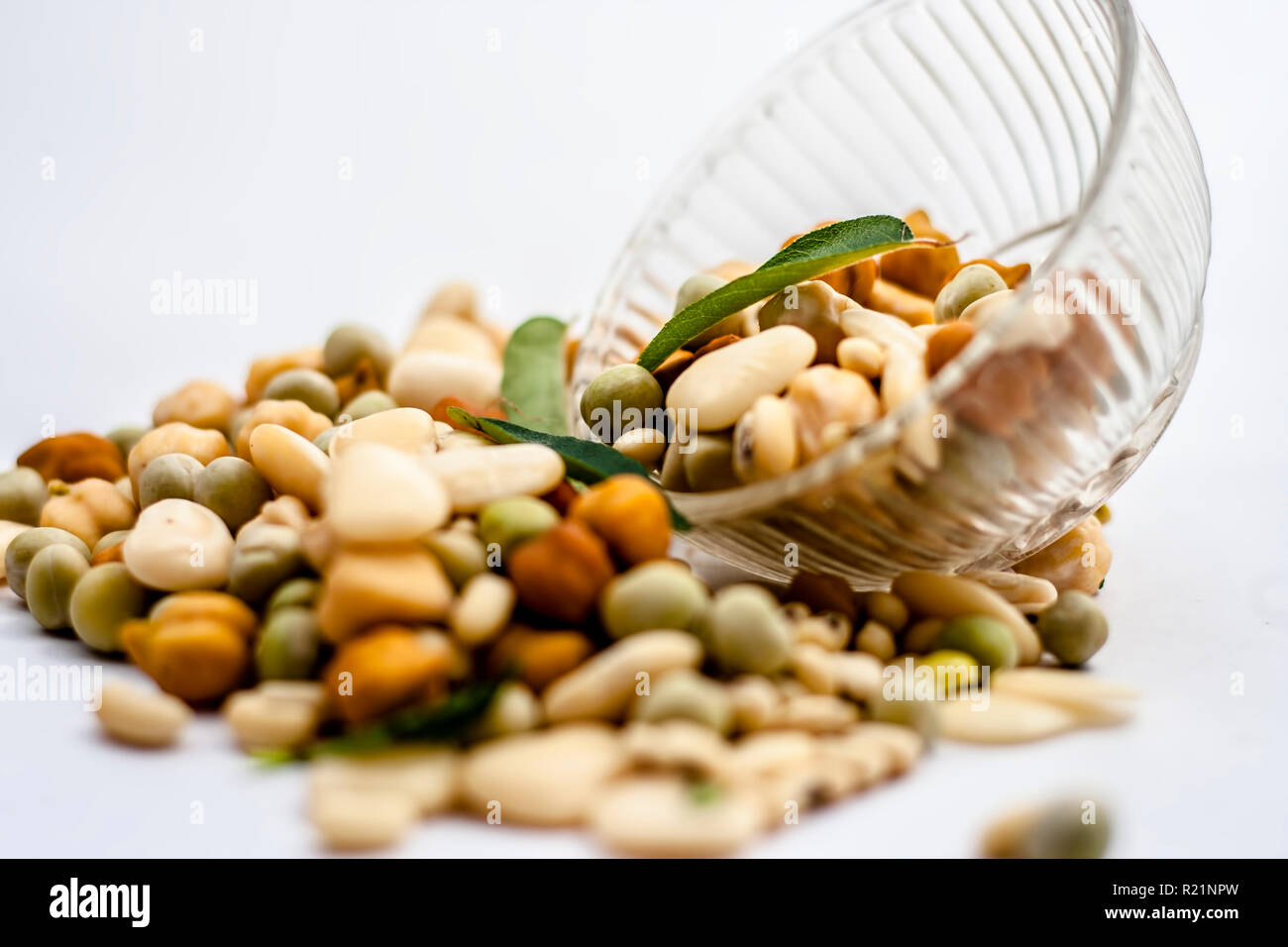 Raw dried organic fresh mixed pulses or mixed grains in a glass bowl ...