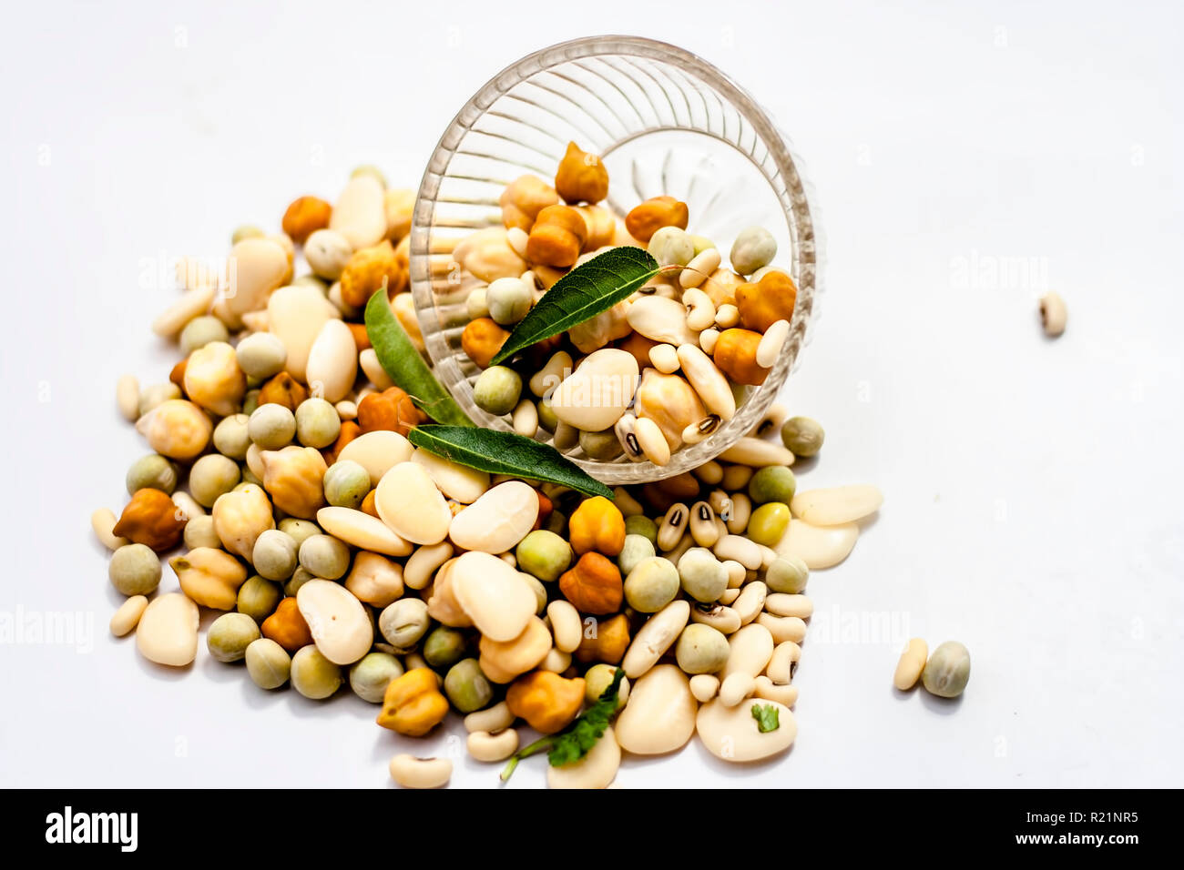 Raw dried organic fresh mixed pulses or mixed grains in a glass bowl ...