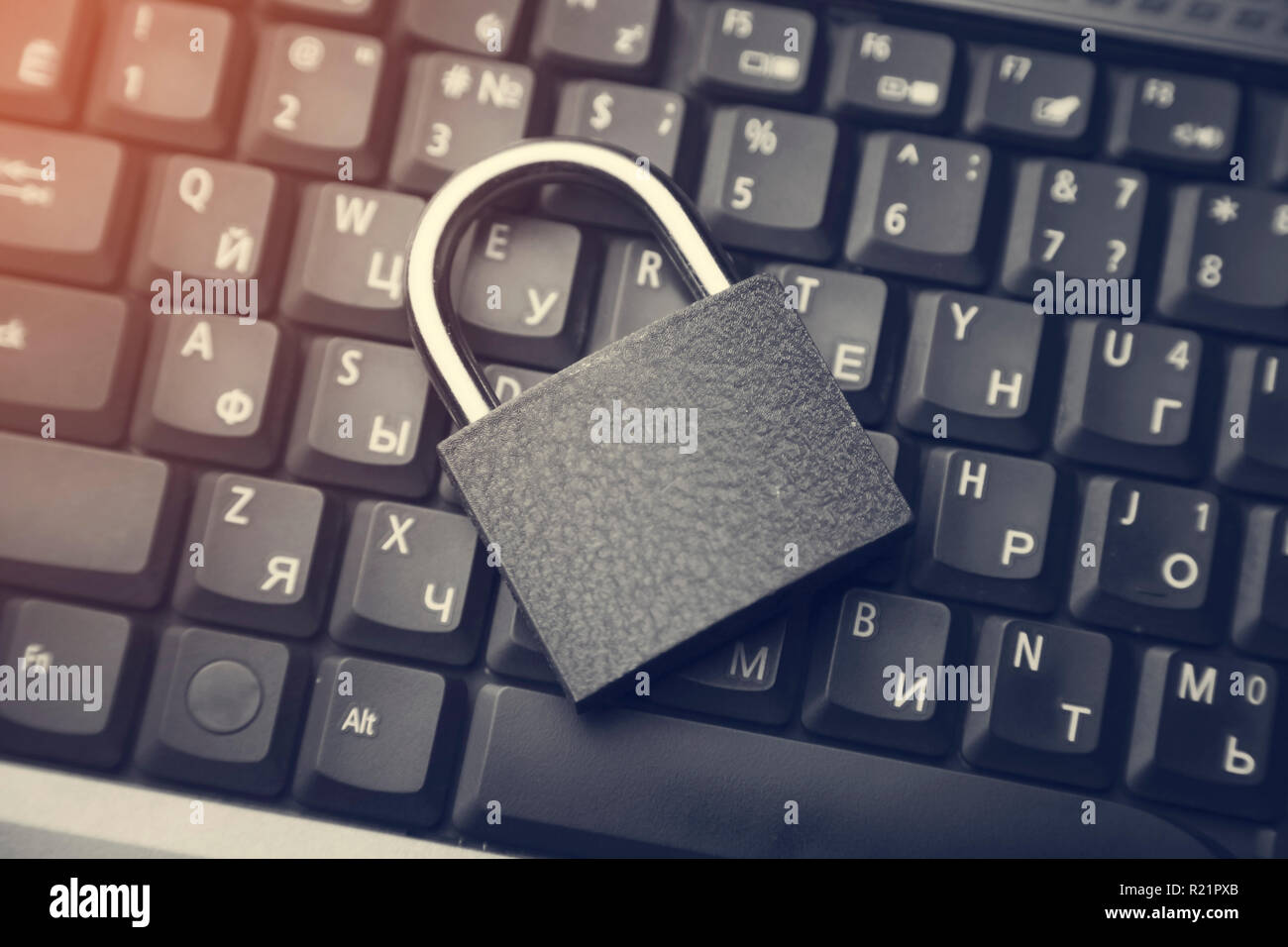 Lock on the laptop keyboard background Stock Photo - Alamy