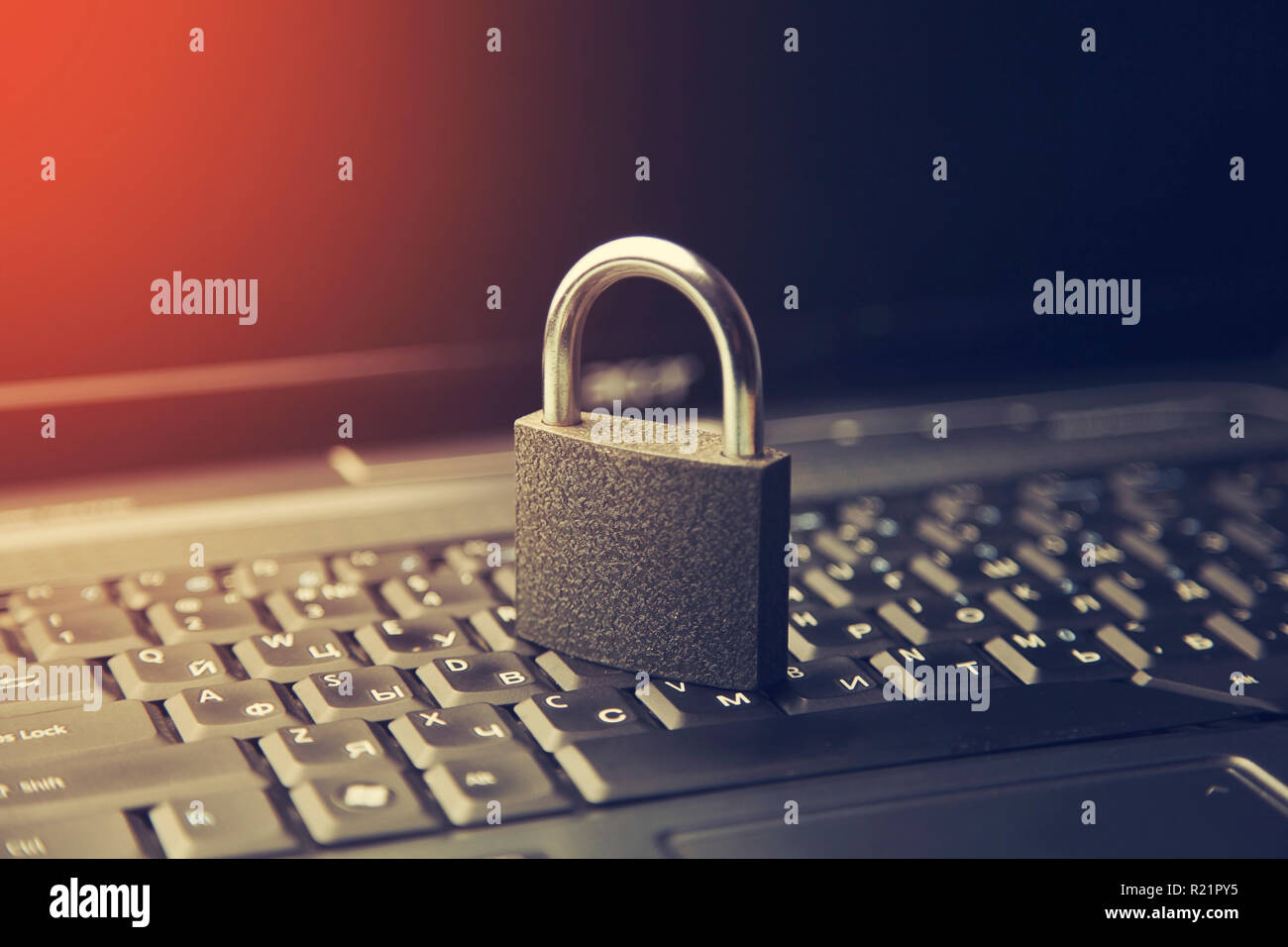 Lock on the laptop keyboard background Stock Photo - Alamy