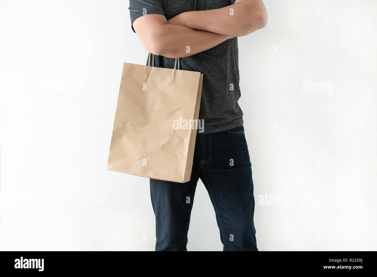 Consumer pack product Man shows bag mock up show Stock Photo - Alamy