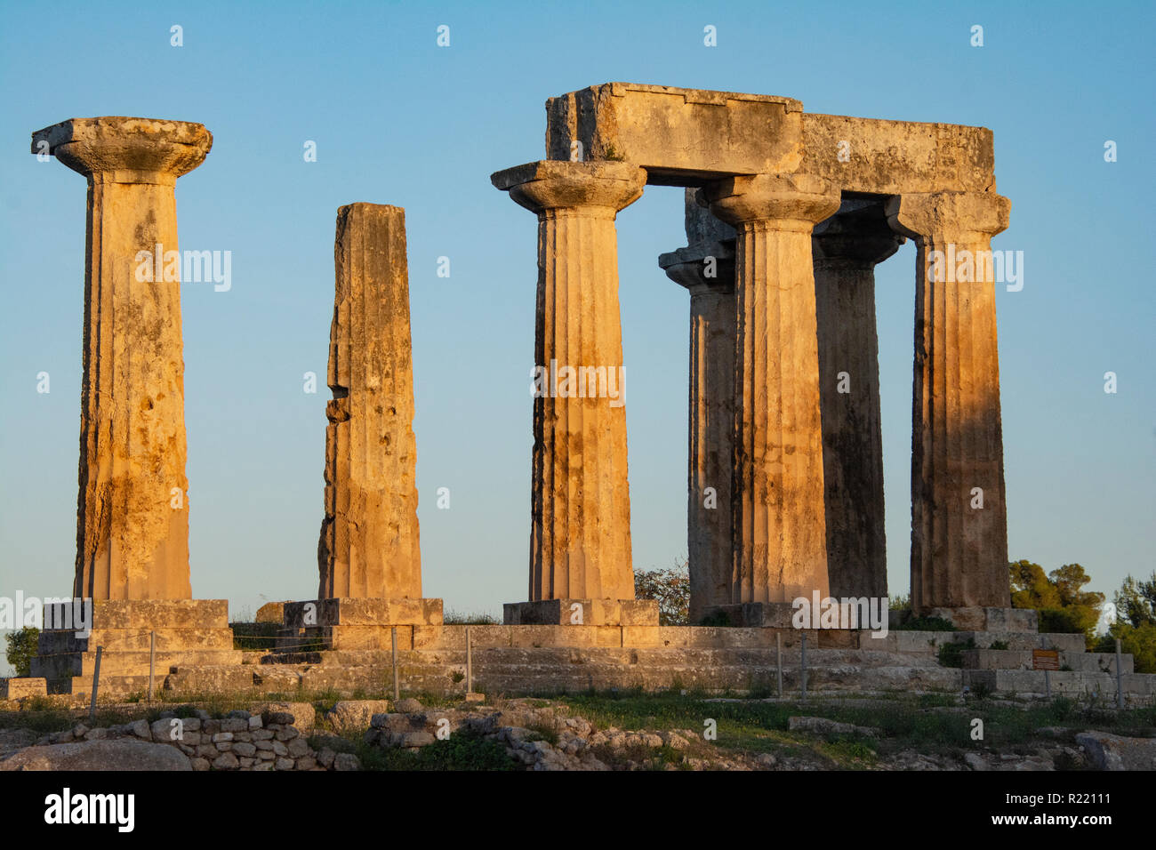 The ruins of a temple in old Corinth dedicated to Apollo Stock Photo ...