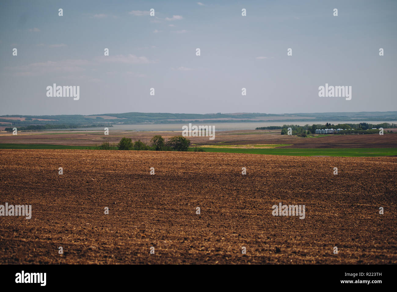 Rural landscape with farmhouse in the distance Stock Photo - Alamy