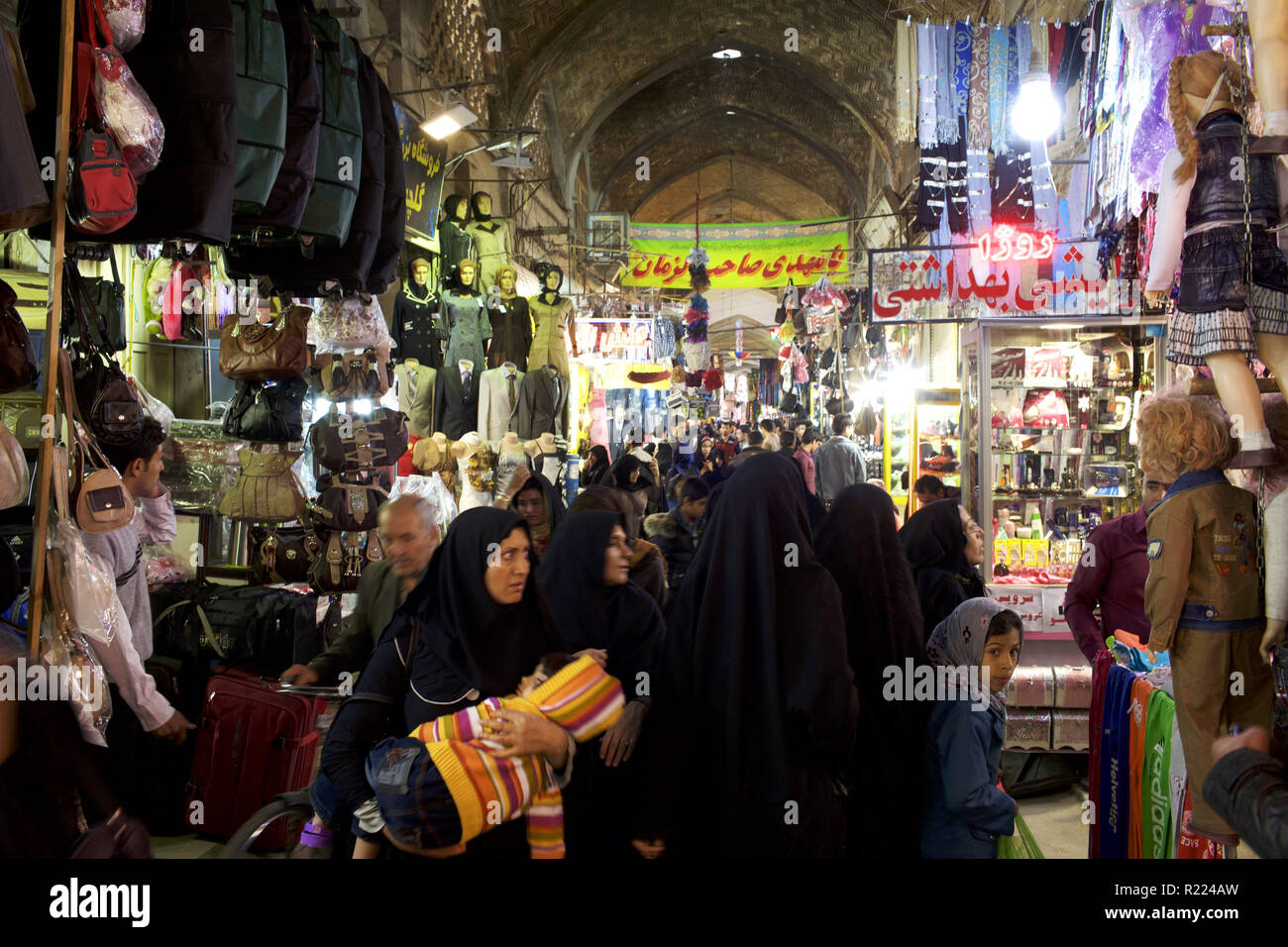 Iran: Isfahan 2011/11/03. Interior of the Grand Bazaar (Royal Bazaar). Veiled women and crowd in ...