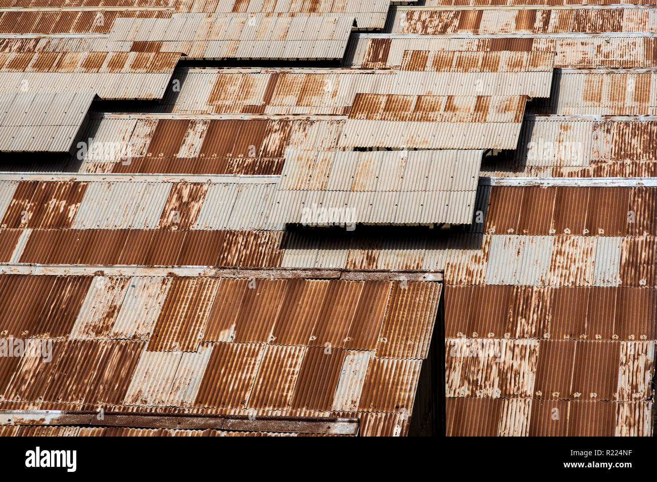 Brown rusted metal roofs of industrial building Stock Photo - Alamy