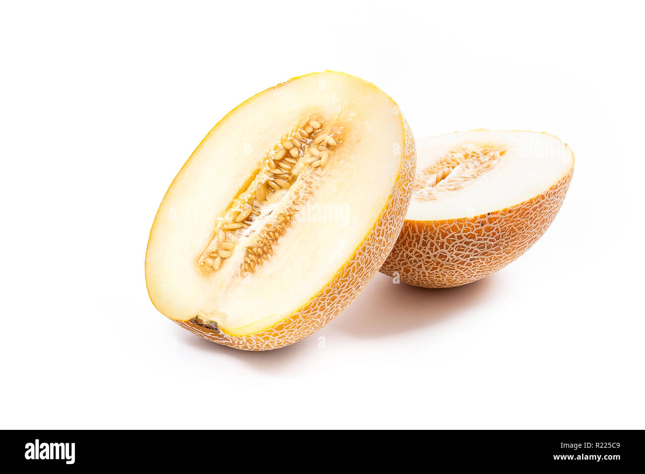 Half ripe juicy melon tropical fruit at summer time isolated on a white ...
