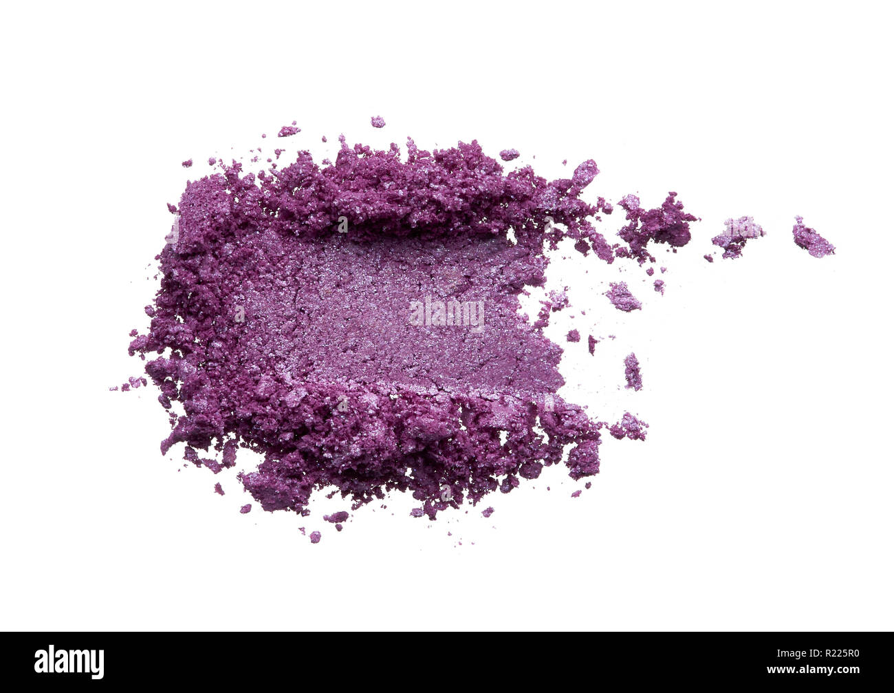 Texture of broken violet eye shadow isolated on white background. Macro ...