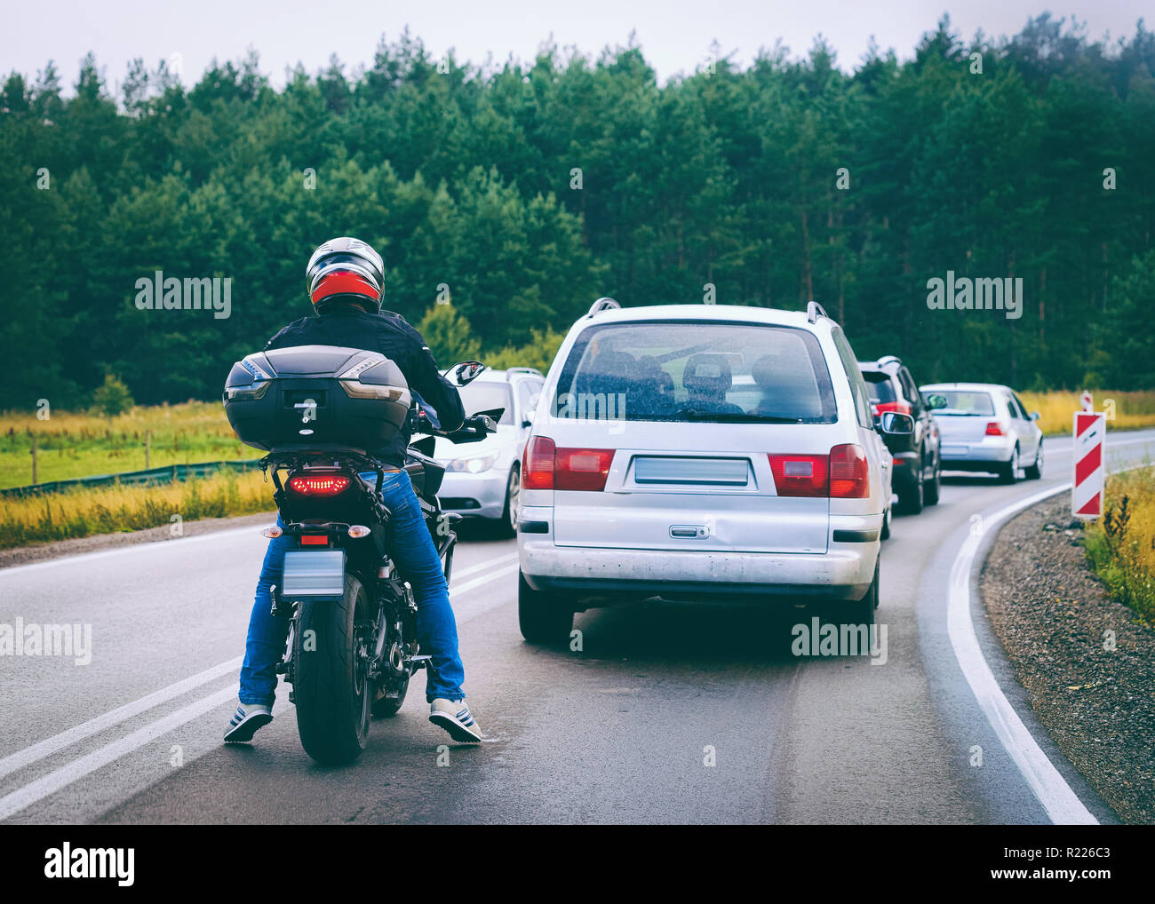 Motorcycle and cars in a traffic jam on the road in Poland Stock Photo ...