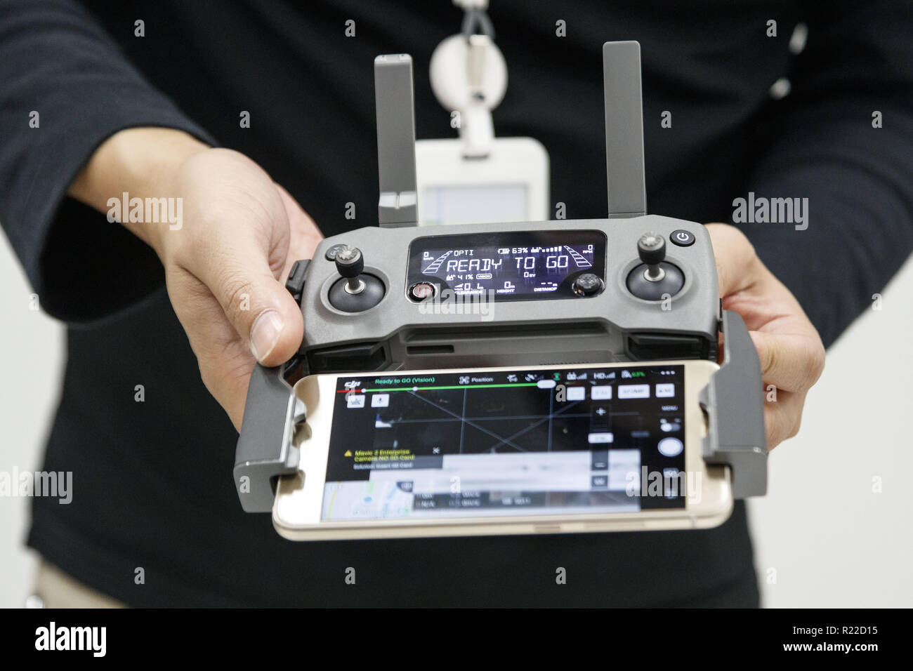Tokyo, Japan. 15th Nov, 2018. A member of staff shows the remote ...