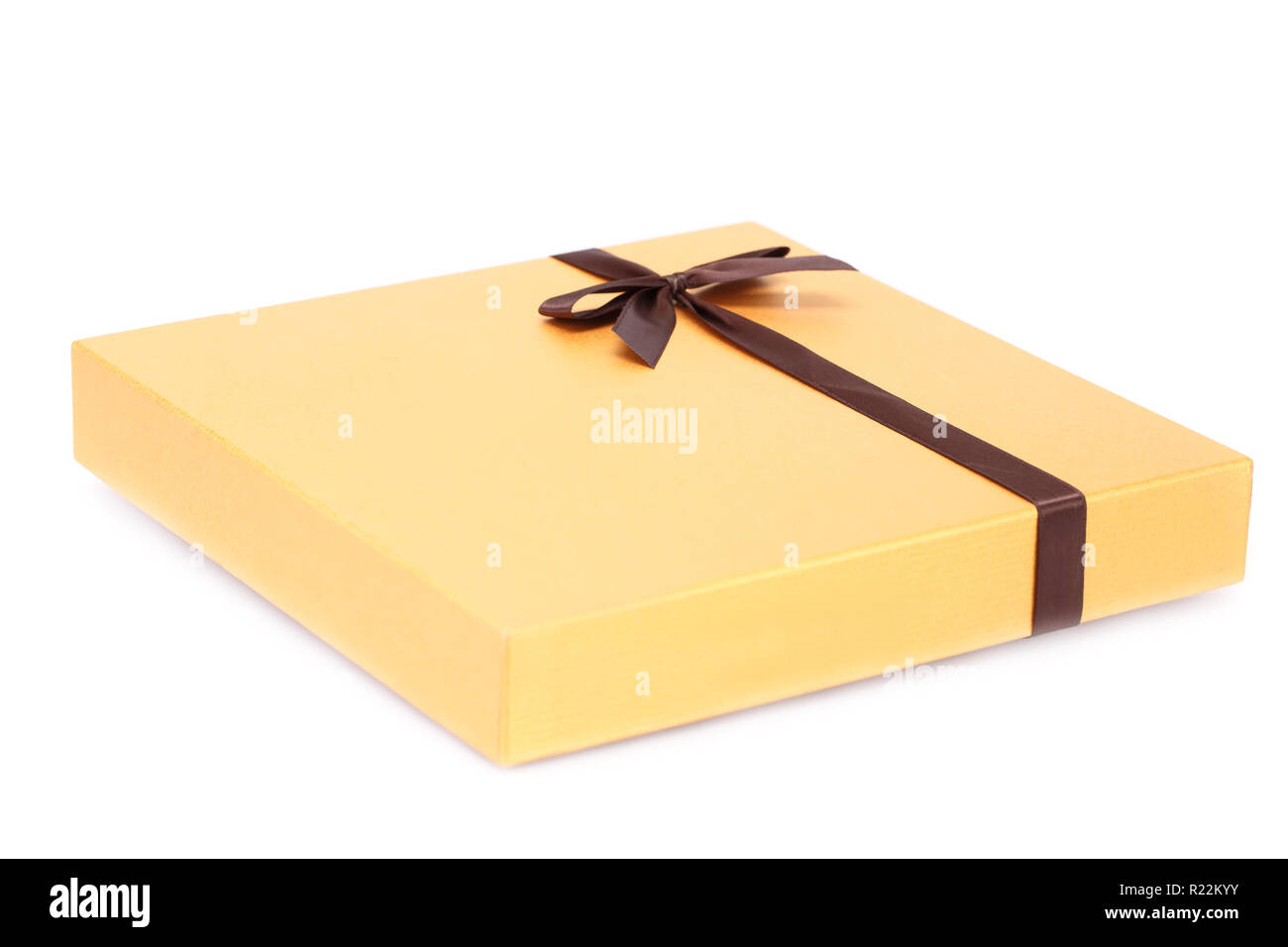 Yellow chocolate box with brown ribbon isolated on white background ...