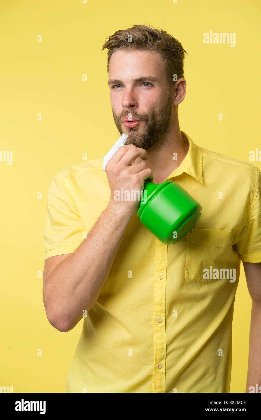 Guy with water spray in hand pretend blow smoke after shooting ...