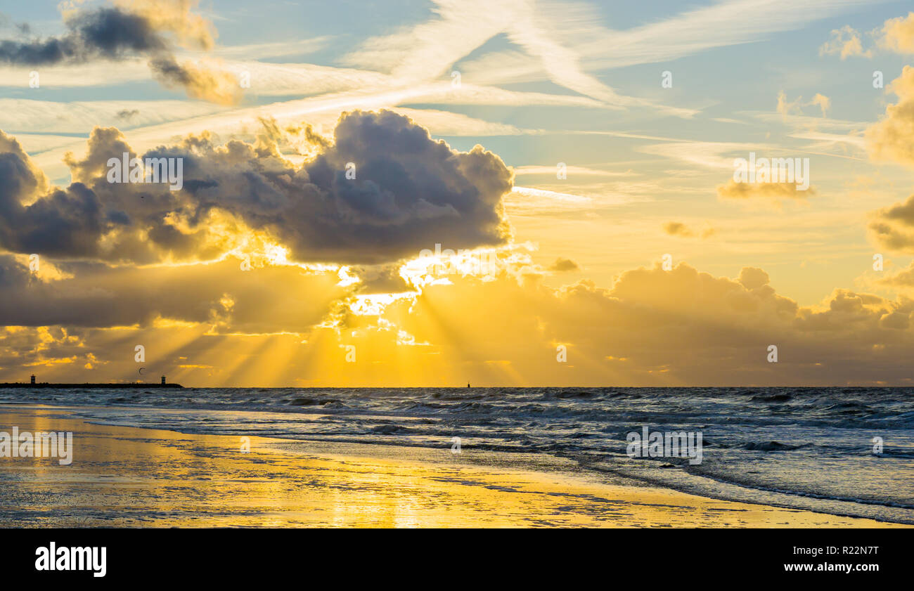 Beach at sundown time giving dawn light effect in the sky and beautiful ...