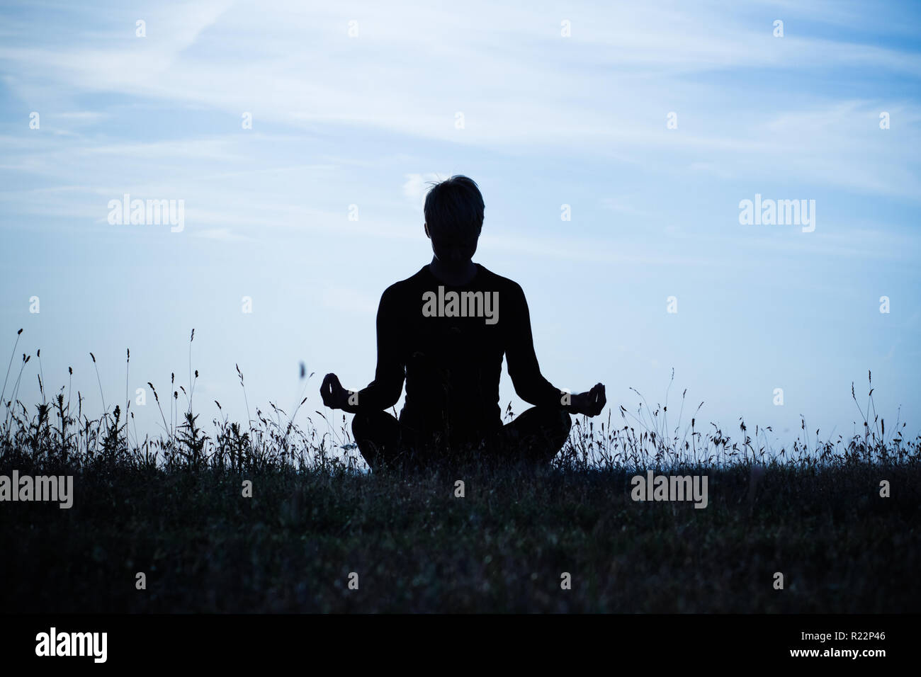 Yoga-Ardha Padmasana/Half-lotus pose Stock Photo - Alamy