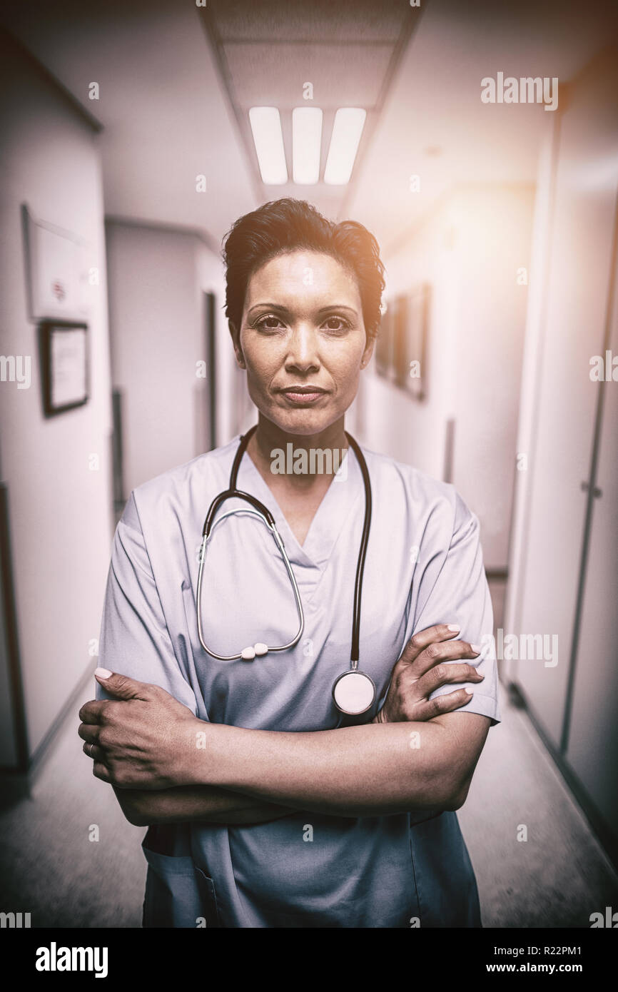 Portrait of female nurse standing in corridor Stock Photo - Alamy