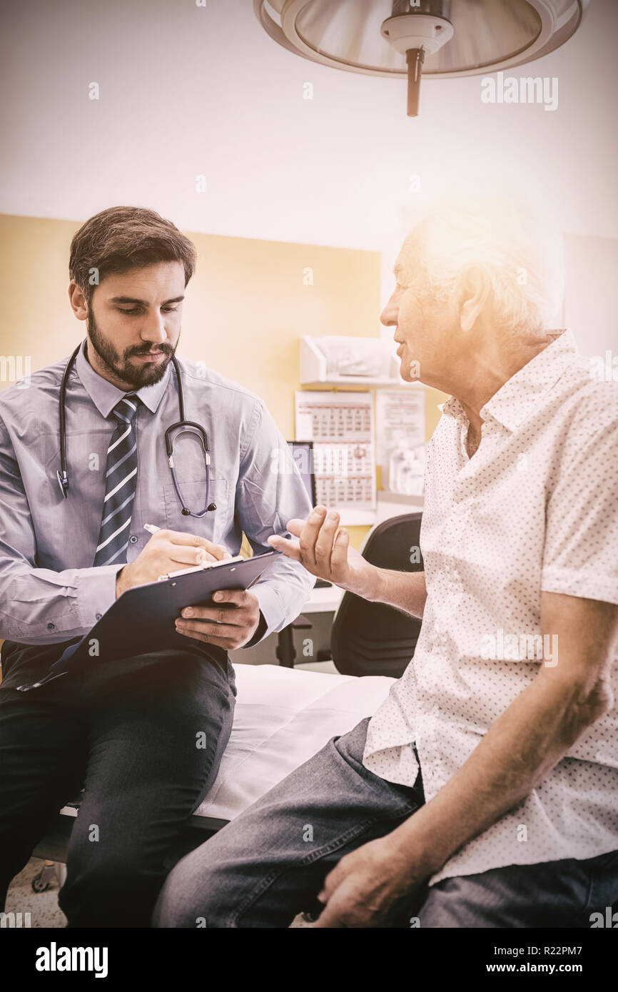 Male surgeon interacting patient hi-res stock photography and images ...