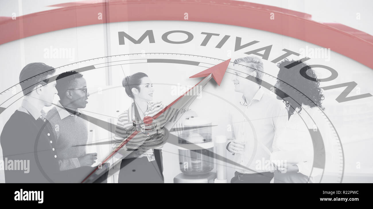 Composite image of compass pointing to motivation Stock Photo - Alamy