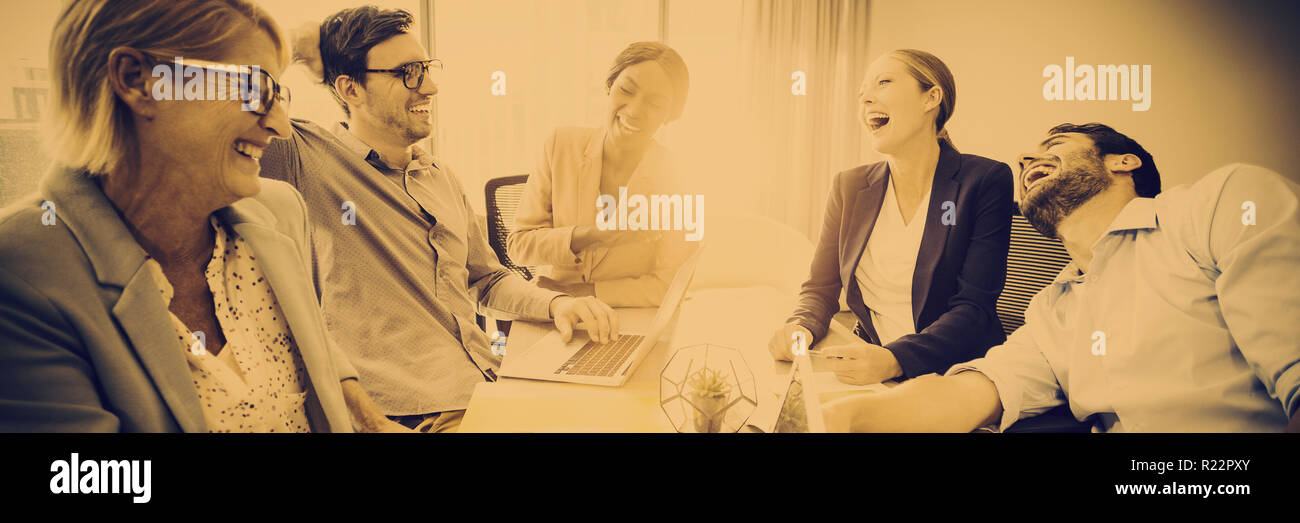Business people laughing during a meeting Stock Photo - Alamy