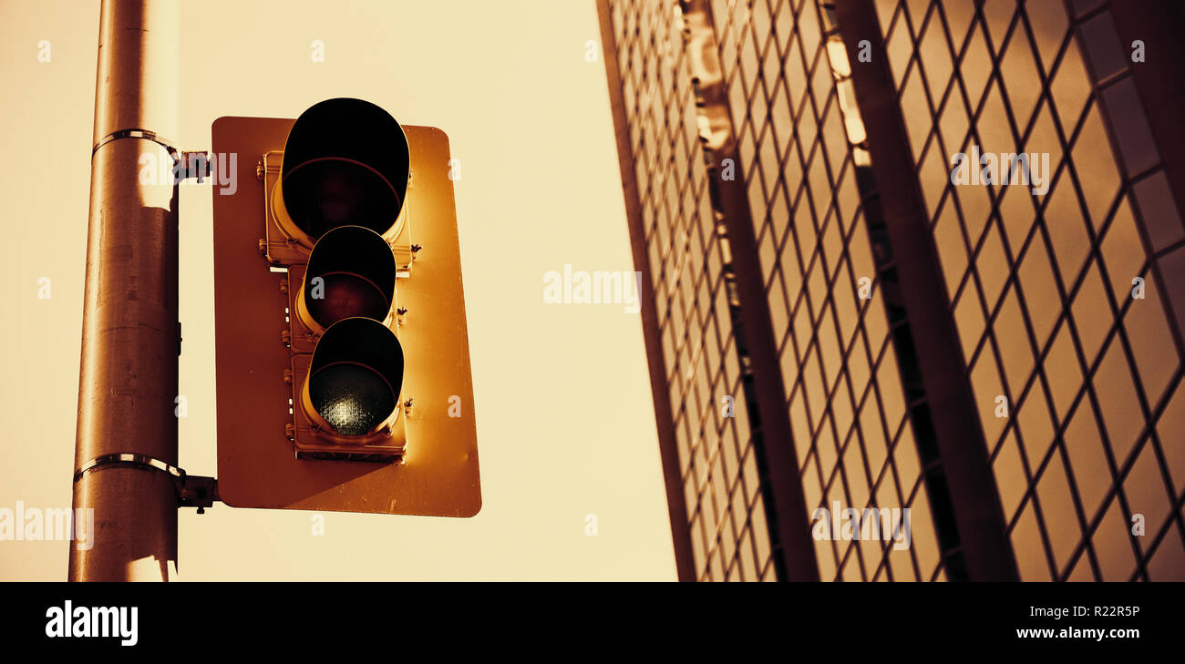 Traffic light with office in the background Stock Photo - Alamy