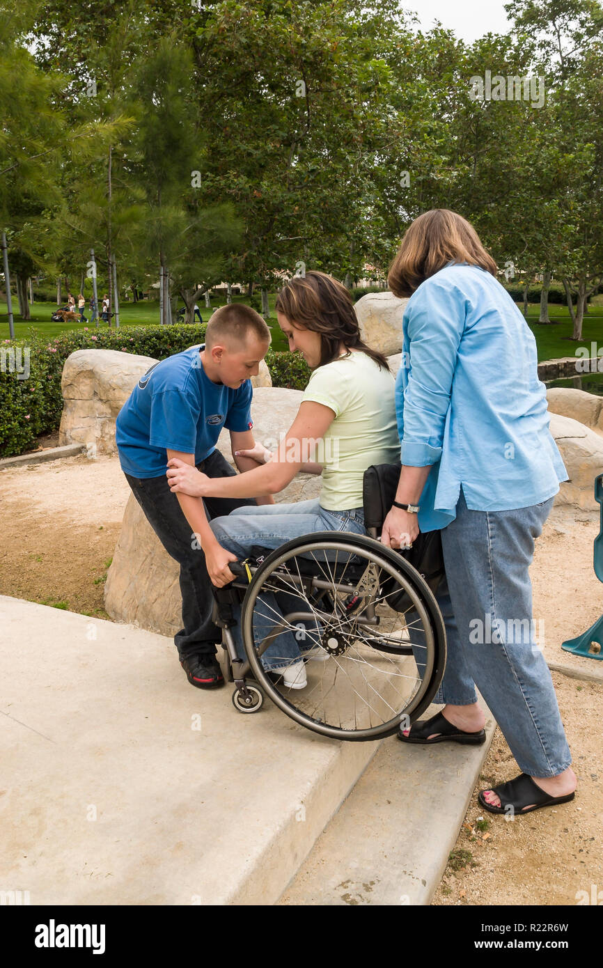Children helping others disability hi-res stock photography and images ...
