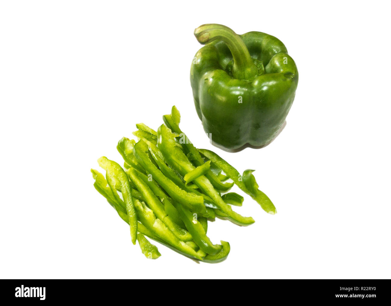 Whole and chopped green capsicums isolated on white background Stock ...
