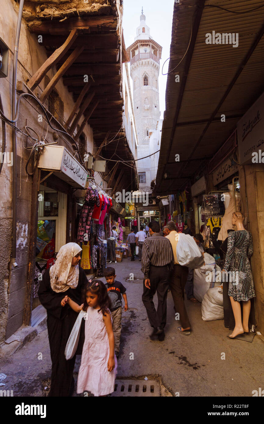 Damascus, Syria : Old town street scene. In background, the minaret of ...