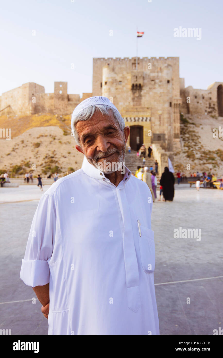 Aleppo, Aleppo Governorate, Syria : An old man stands outside the ...