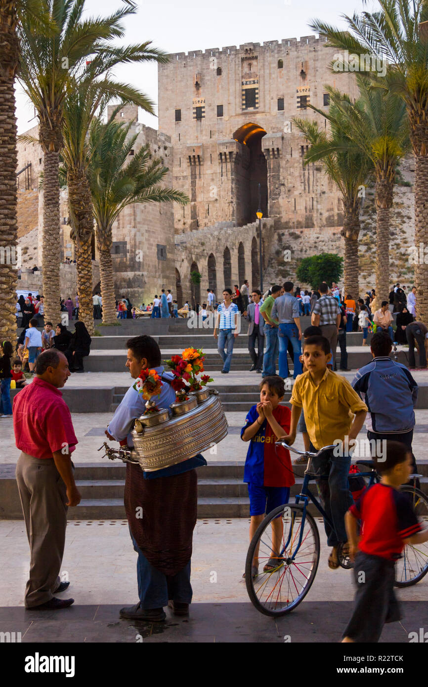 Aleppo, Aleppo Governorate, Syria : People walk past the Citadel of ...