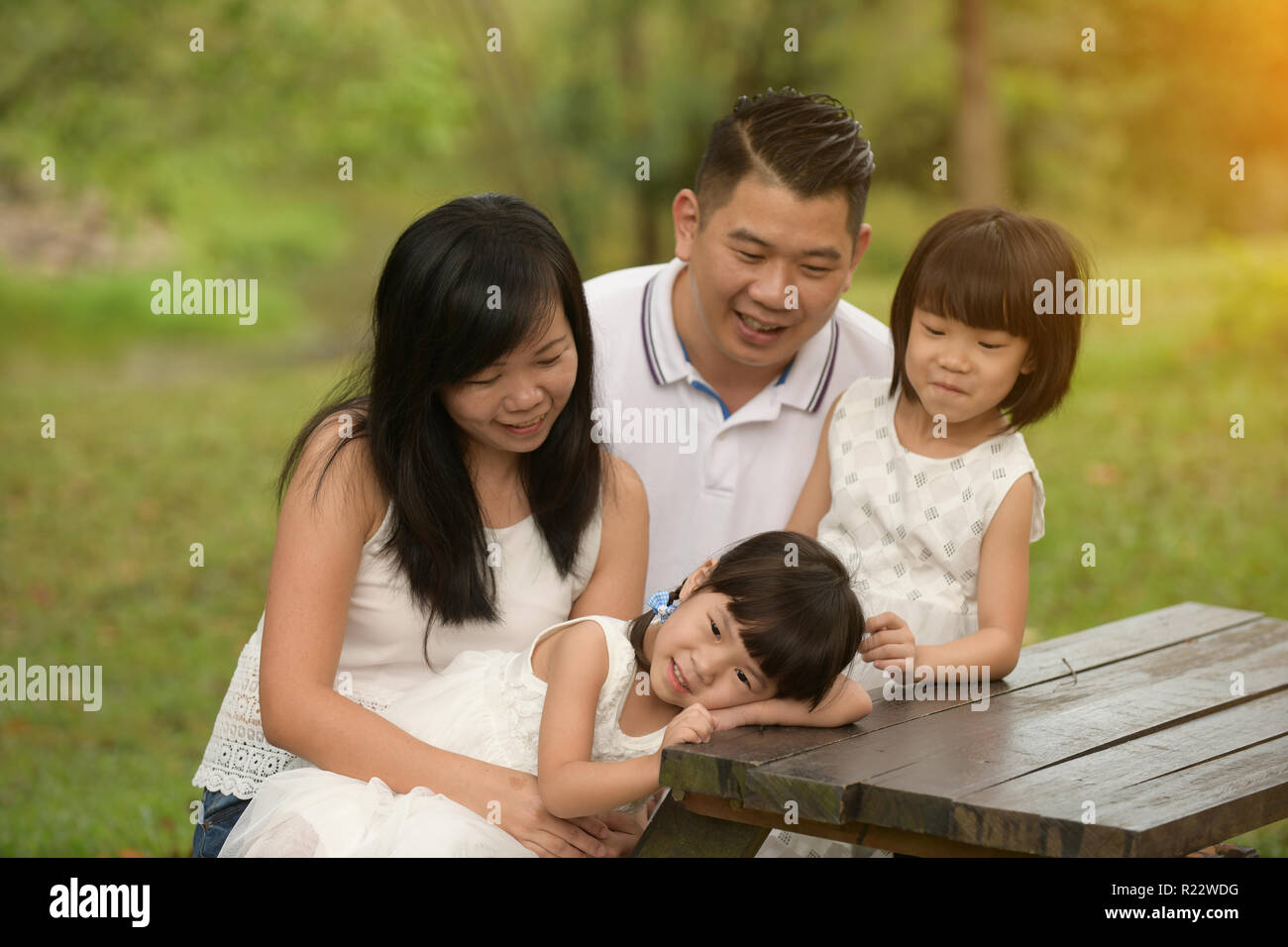 Happy Asian Family enjoying their time in the park Stock Photo - Alamy