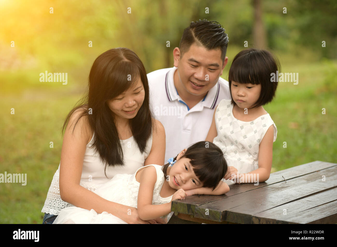 Happy Asian Family enjoying their time in the park Stock Photo - Alamy