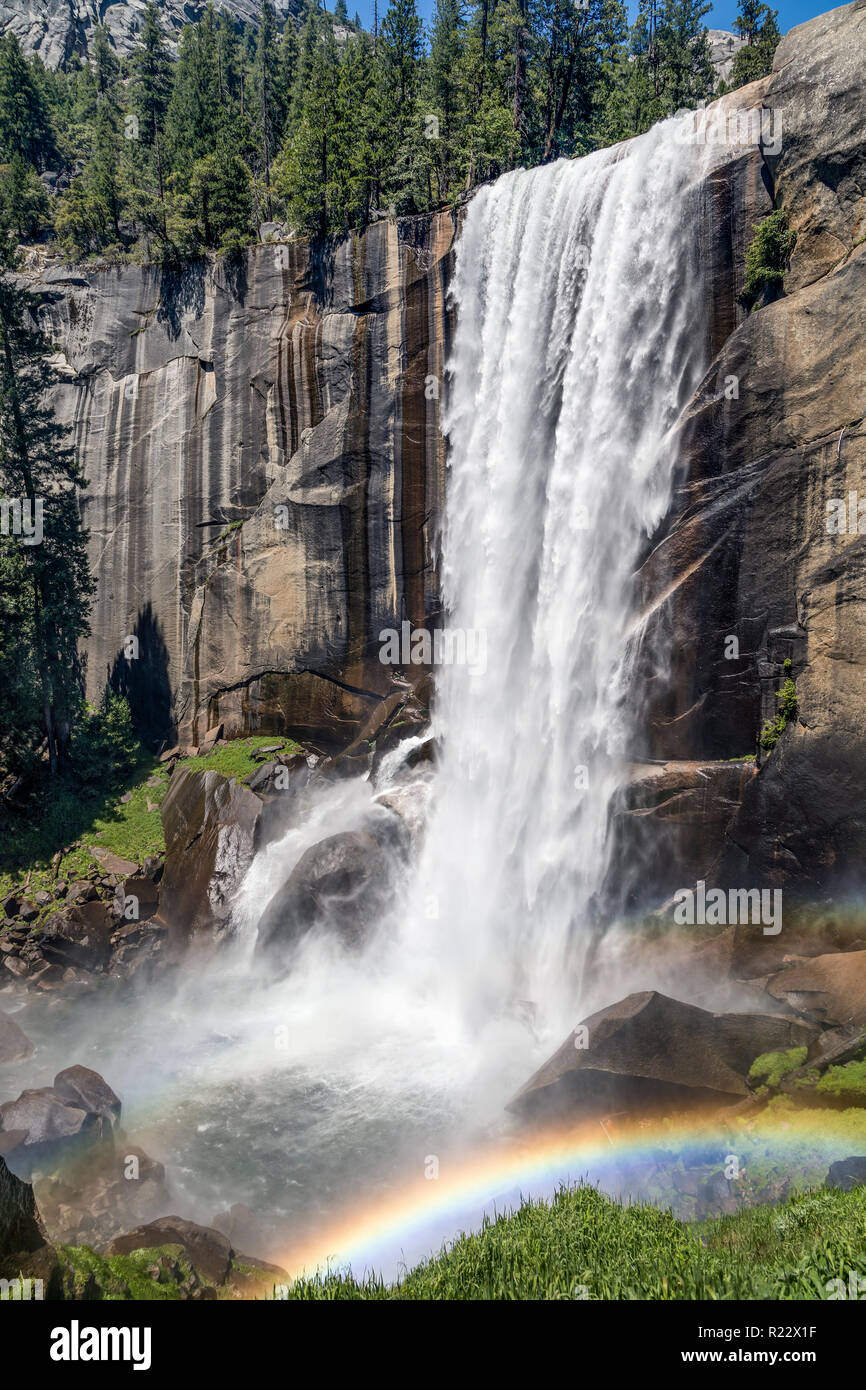 The wet, misty spray surrounding Vernal Falls, on the Merced River in ...
