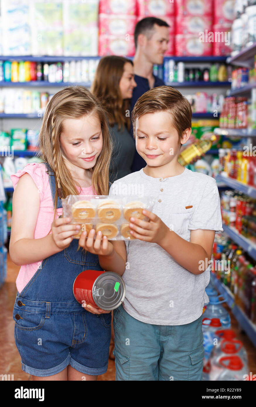 positive children are holding meal for home in the supermarket Stock ...