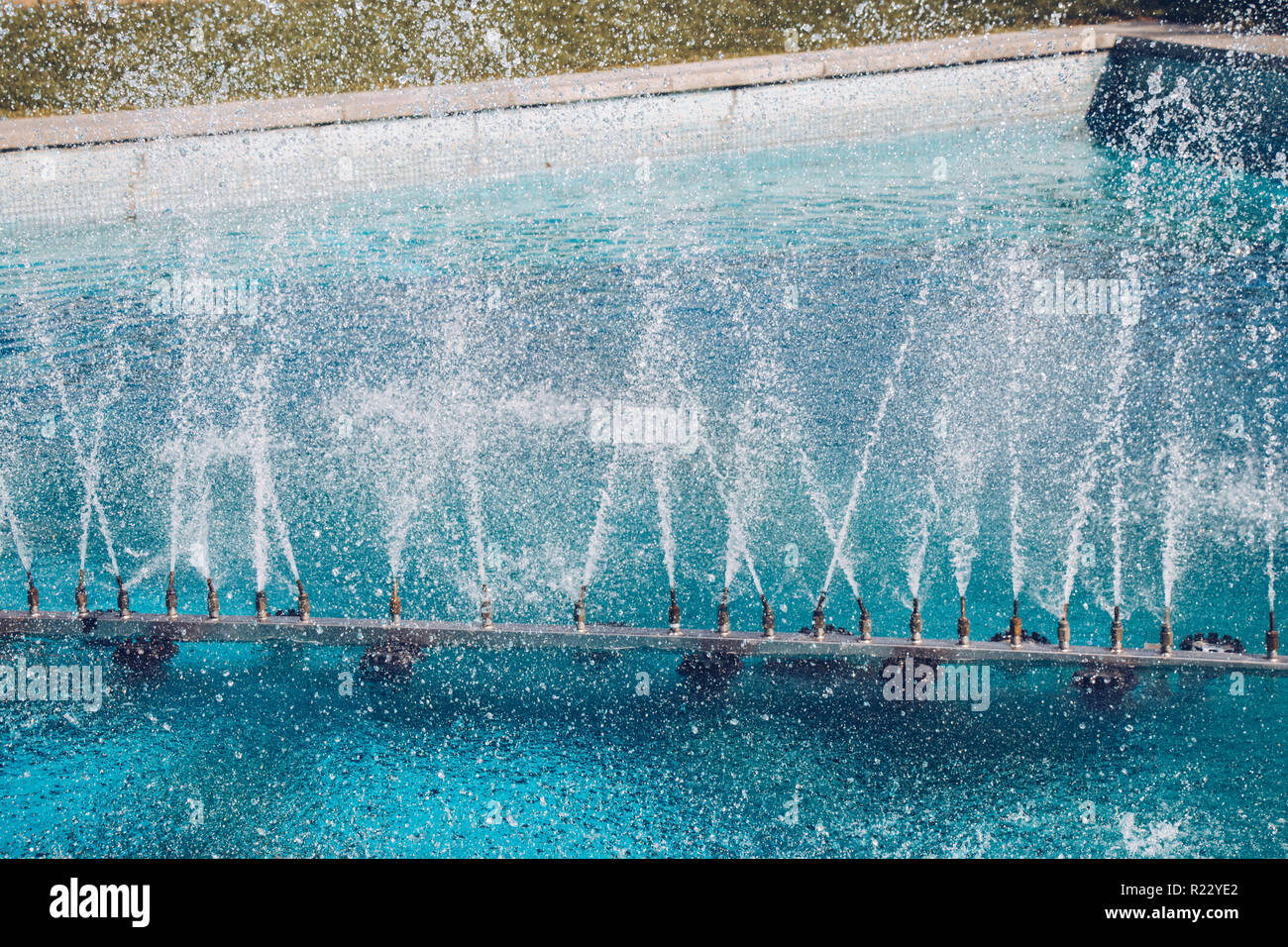 A water fountain sprinkling water in the view Stock Photo - Alamy