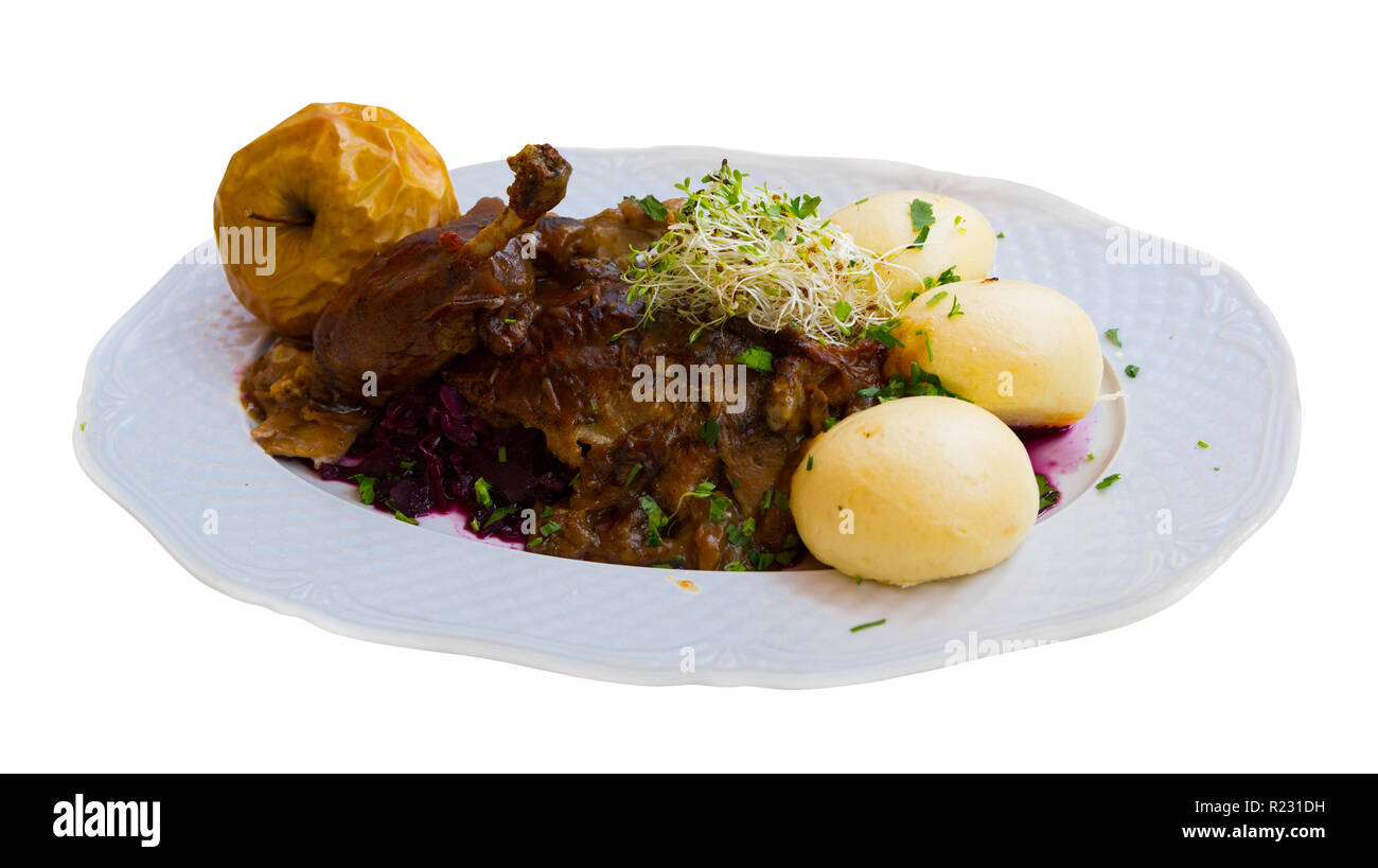Delicious baked duck with blue cabbage and yeast dumplings decorated ...