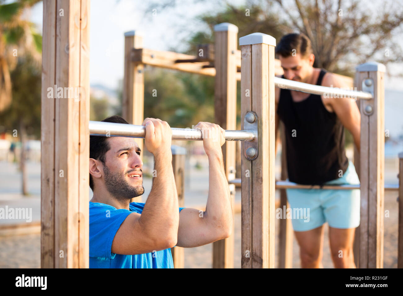 Guy doing pull ups in park hi-res stock photography and images - Alamy