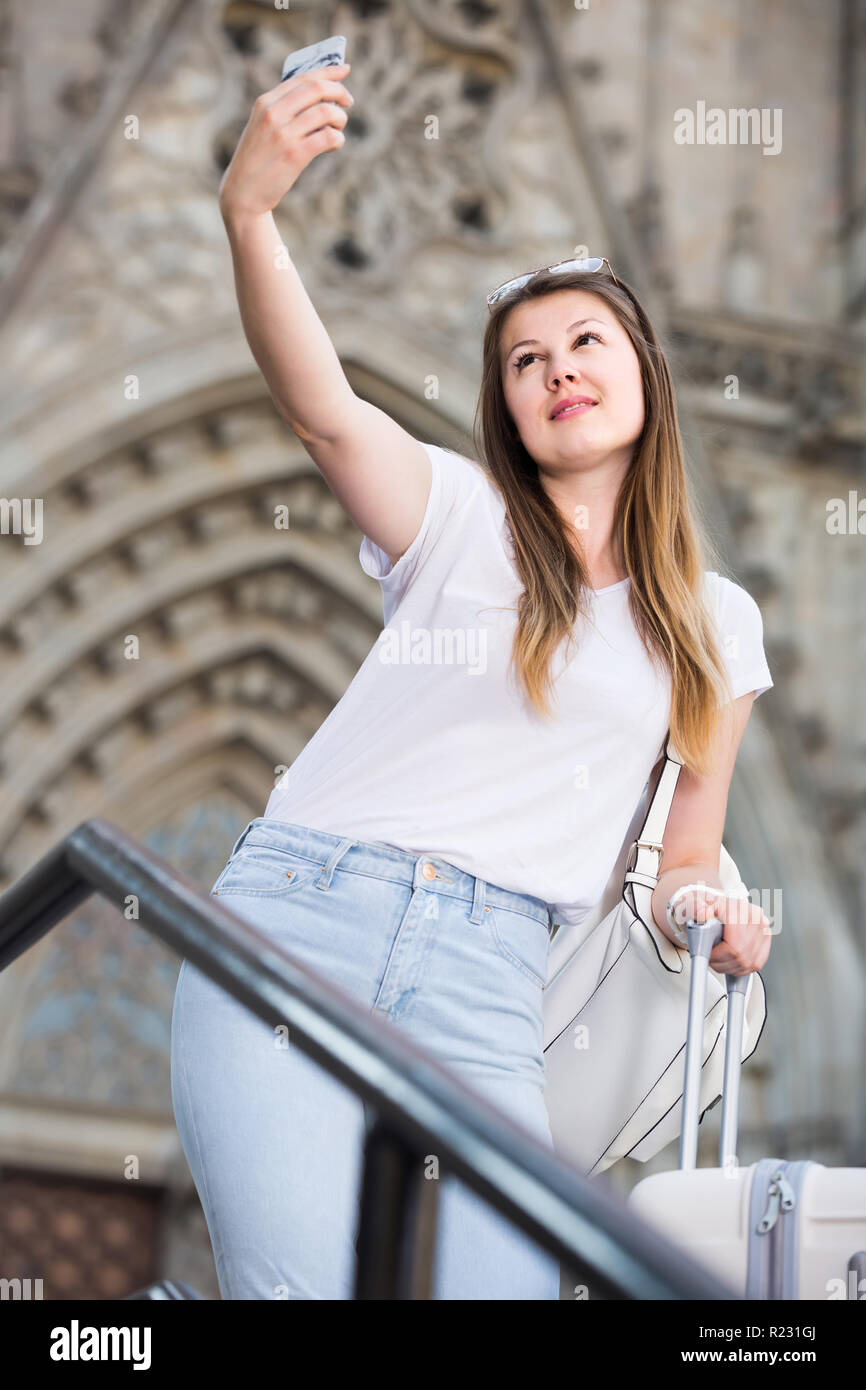 Young happy italian traveler walking the city and doing selfie Stock ...