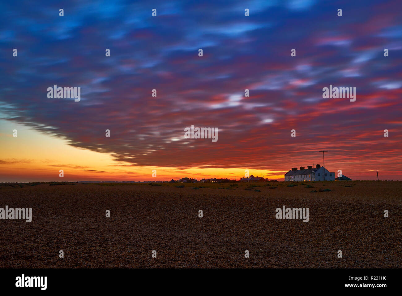 A dramatic and impressive sunset over the Coastguard cottages at ...
