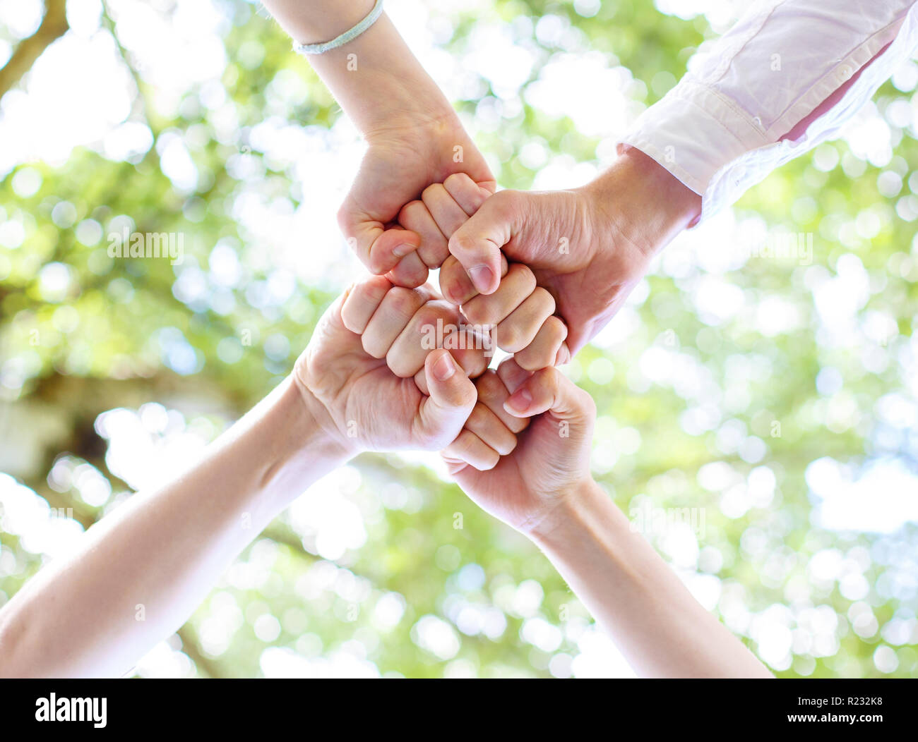 Teenagers joined their hands in a circle Stock Photo - Alamy