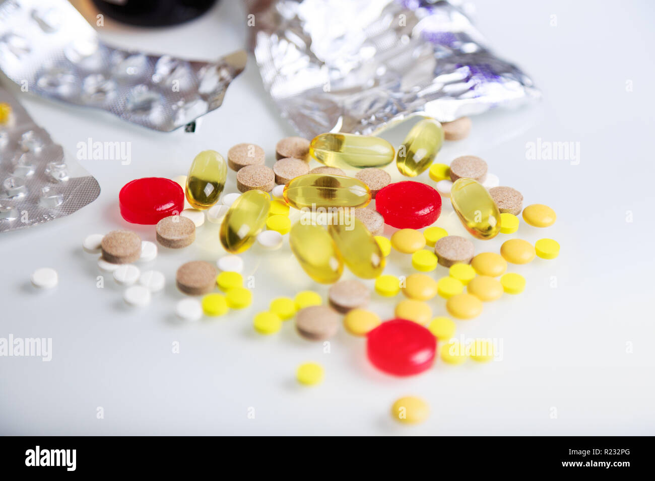 Colored tablets and capsules. Assorted pharmaceutical medicine pills ...