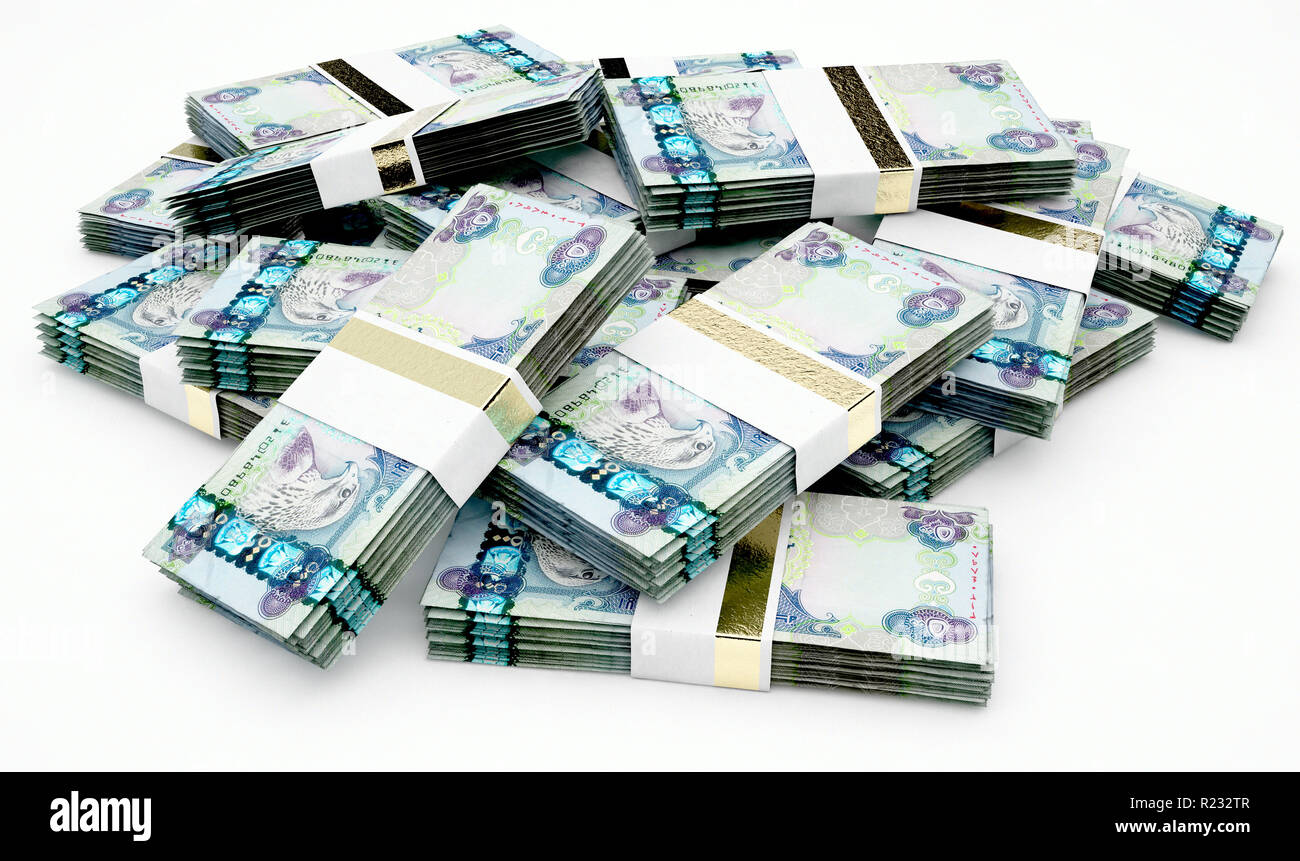 A pile of randomly scattered bundles of UAE Dirham banknotes on an ...