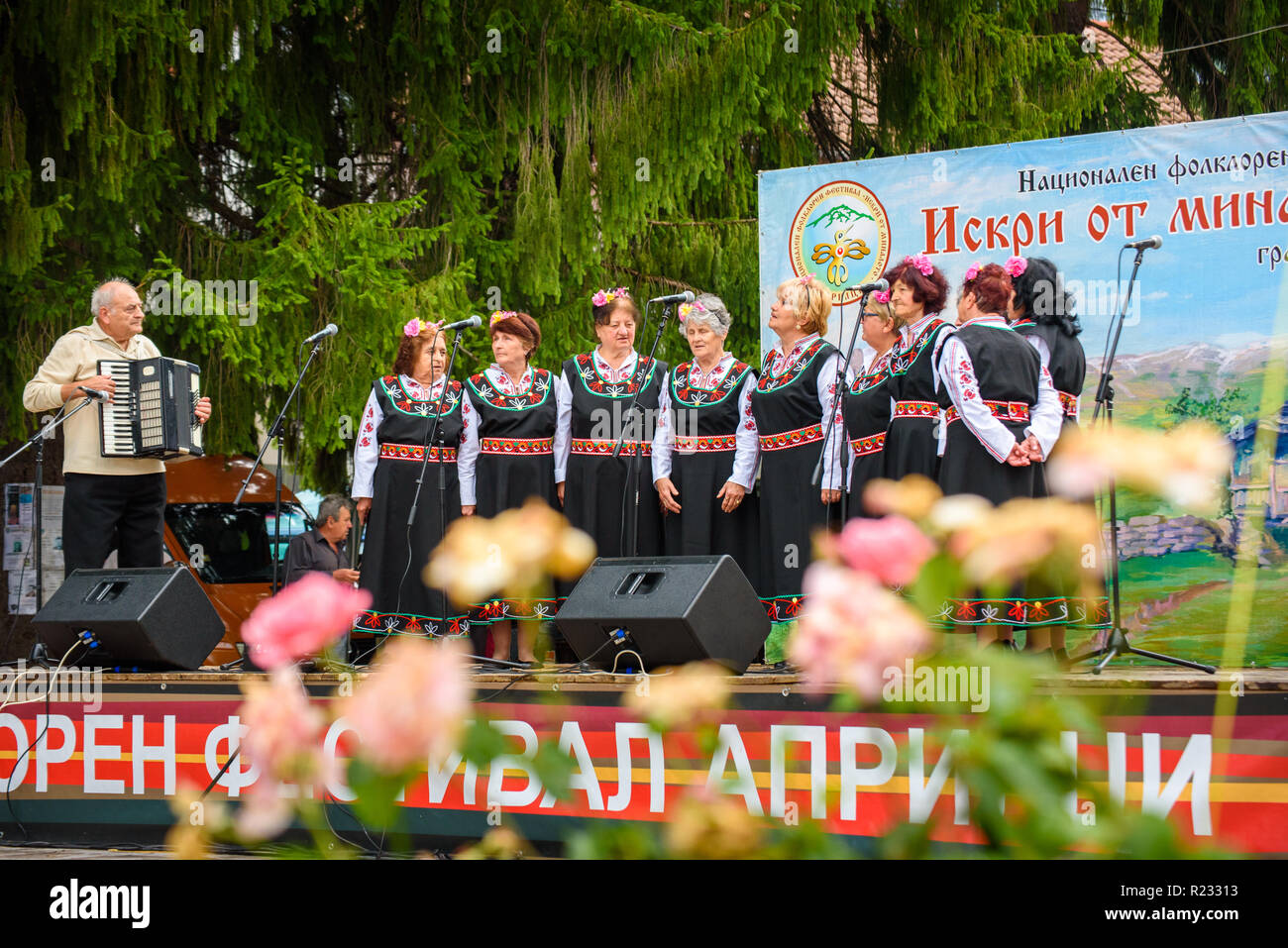 Group of women in traditional Bulgarian folk costumes - singing a song ...