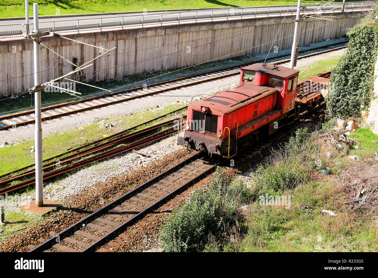 An old red transport locomotive train on the railroad. Red train. Old ...