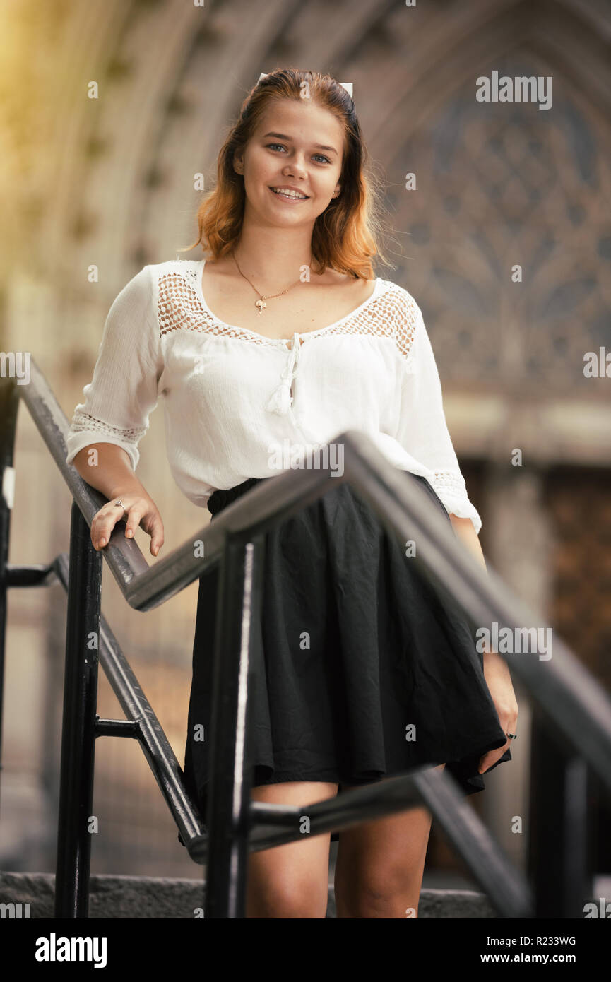girl standing on the stone stairs and handrail at the street Stock ...