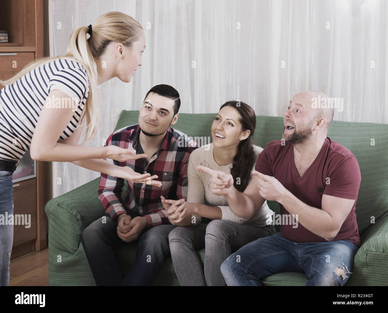 Group of positive young adults having fun at house booze party Stock ...