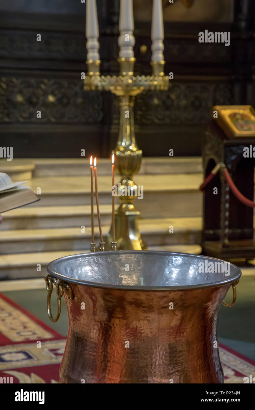 Christening in the church. Church utensils in the Orthodox church. A ...